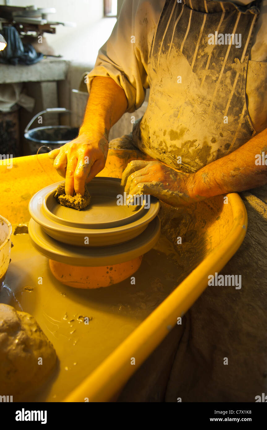 A potter at work in the Wensleydale Pottery in Hawes in Wensleydale in ...