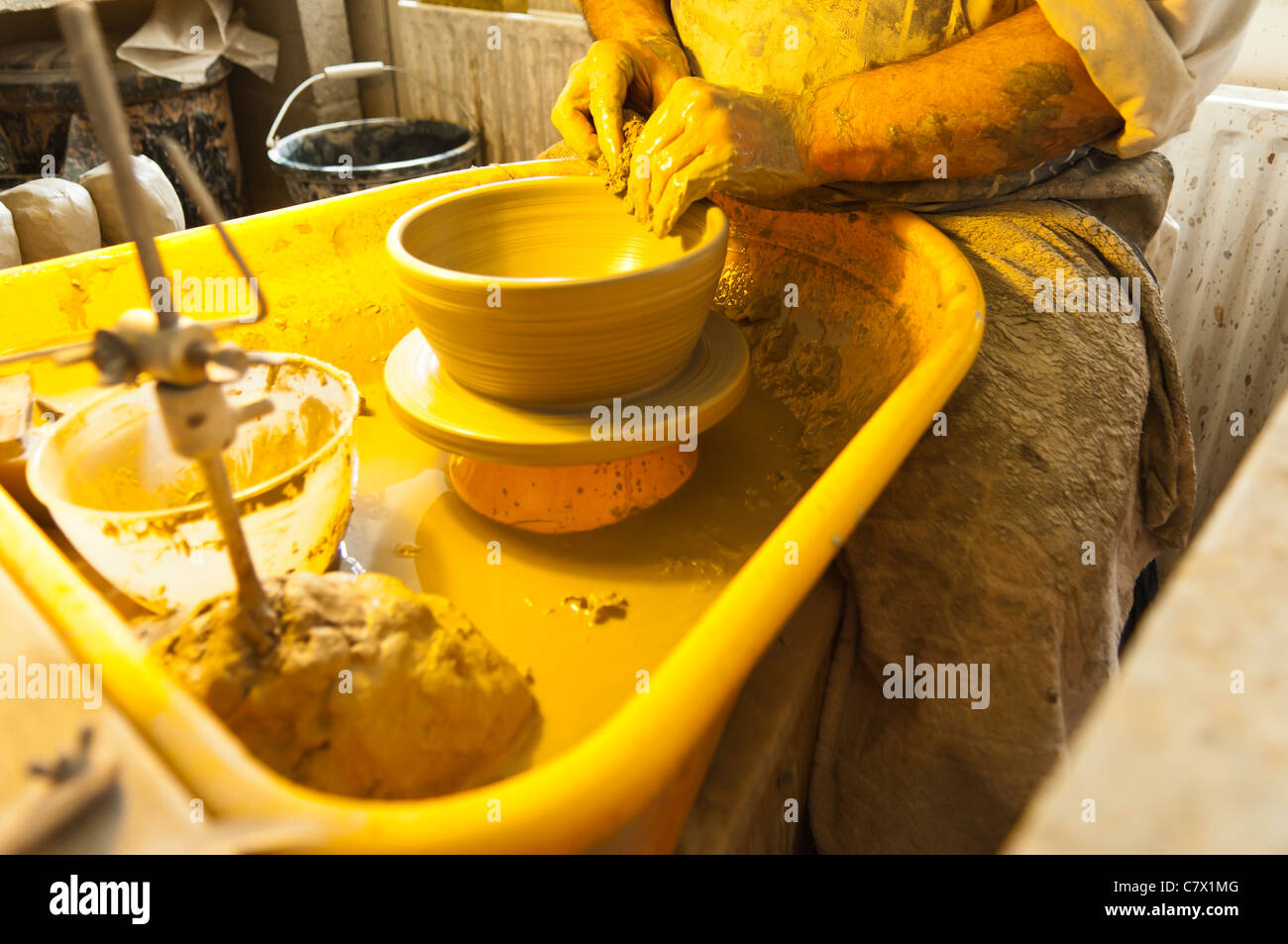 A potter at work in the Wensleydale Pottery in Hawes in Wensleydale in ...