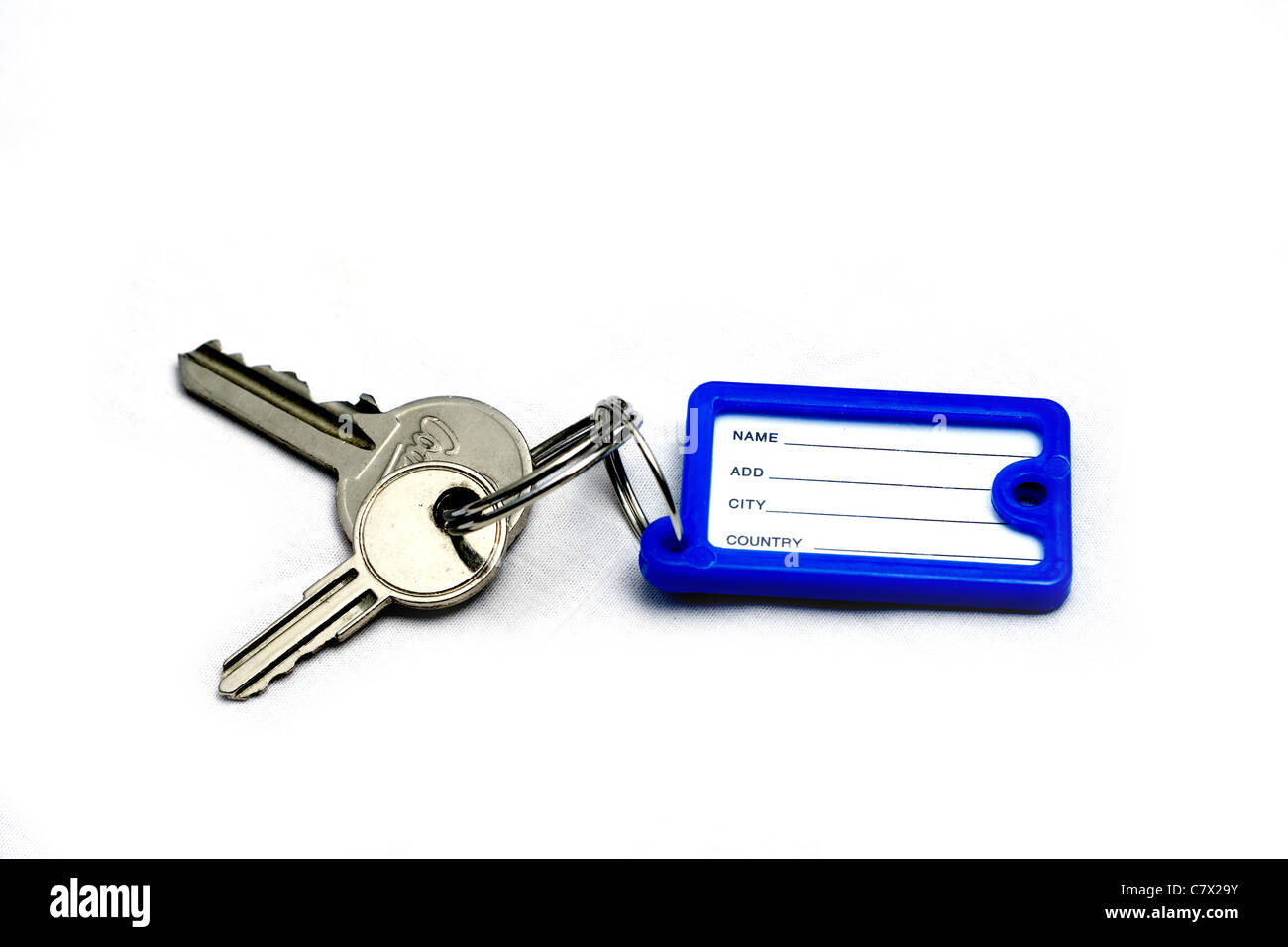 keys with blue address label Stock Photo - Alamy