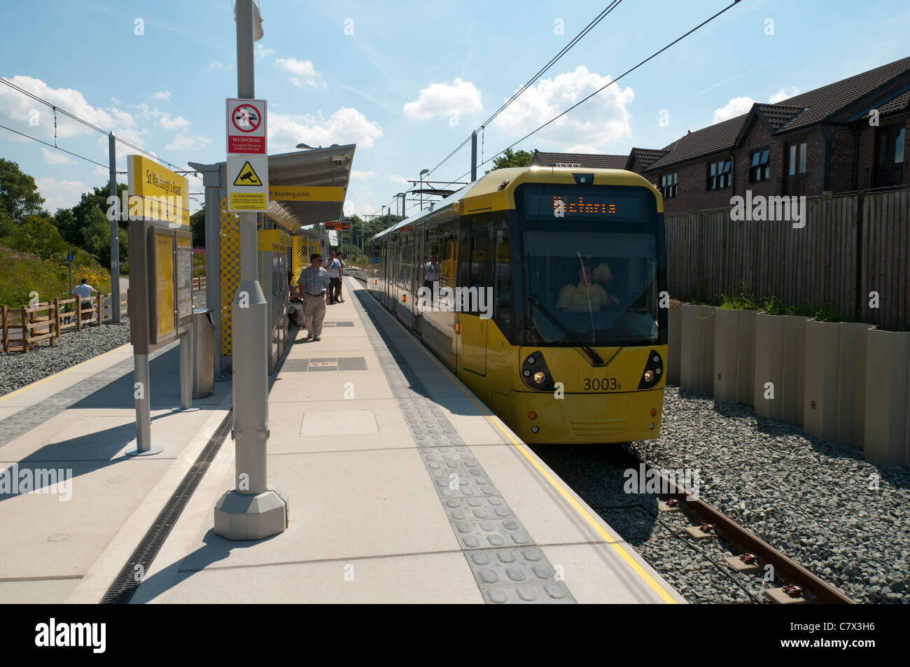 A tram at the St. Werburgh's Road stop on the South Manchester line of ...