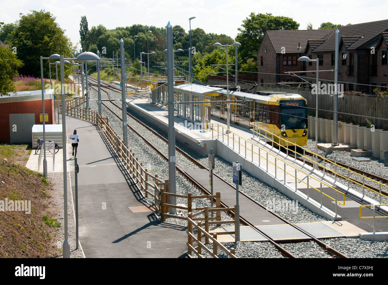 A tram at the St. Werburgh's Road stop on the South Manchester line of ...