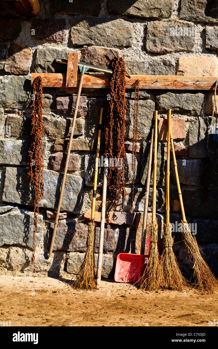 Farm equipment / barn broom shovel Stock Photo - Alamy