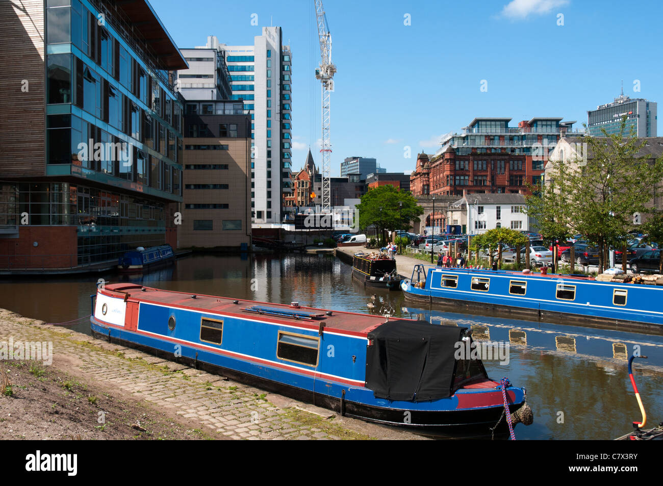 Narrowboats at Piccadilly Basin on the Rochdale Canal, Manchester ...