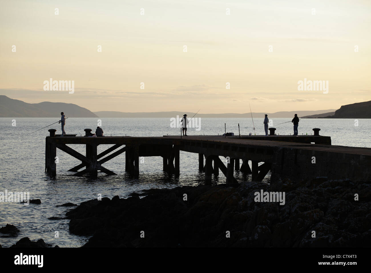 Fishing in the Firth of Clyde on Portencross Pier at sunset, North ...