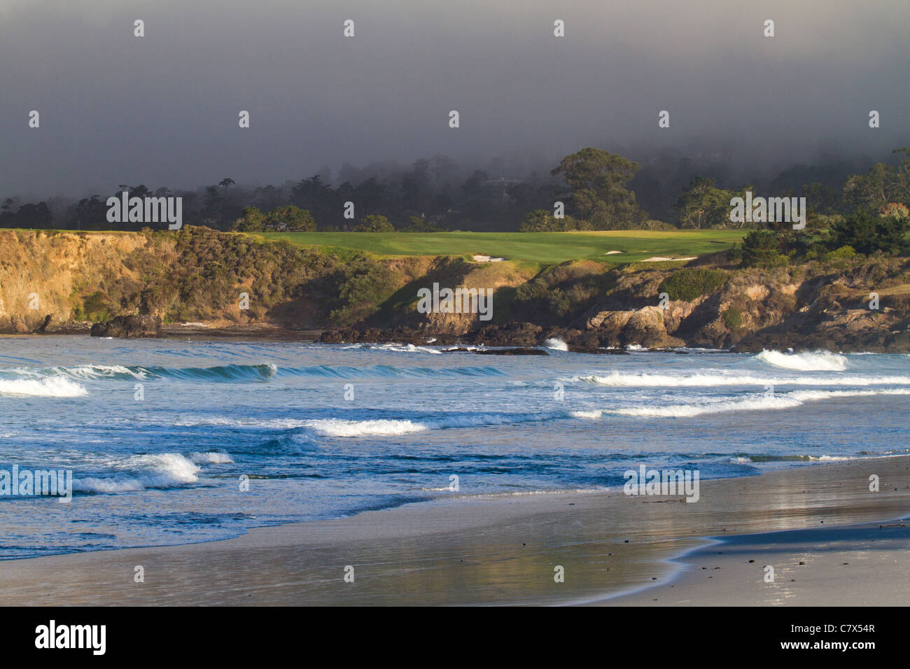 Waves crashing on the shore of Carmel Beach, California, with the ...