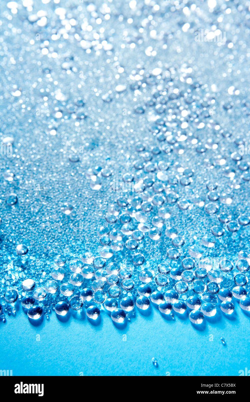 crystal glass pearls little balls texture on blue background Stock ...