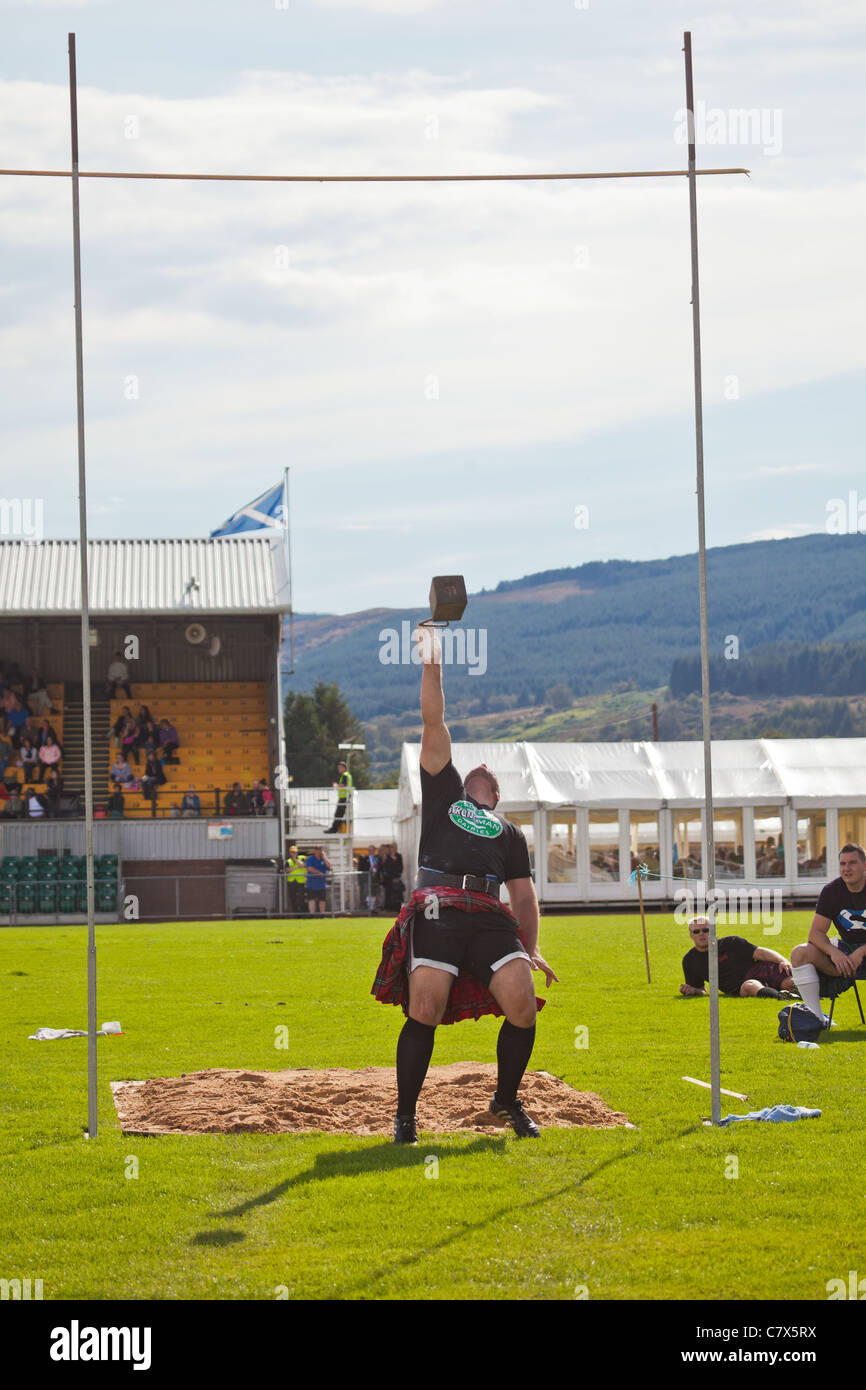 Gregor Edmunds, 'heavy' athlete, throwing the 56lb weight for height at ...