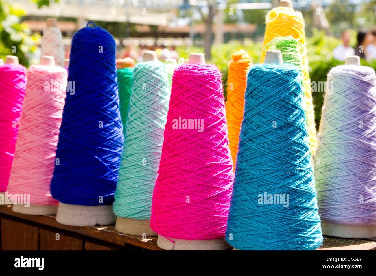 Embroidery colorful thread spool in rows Stock Photo - Alamy
