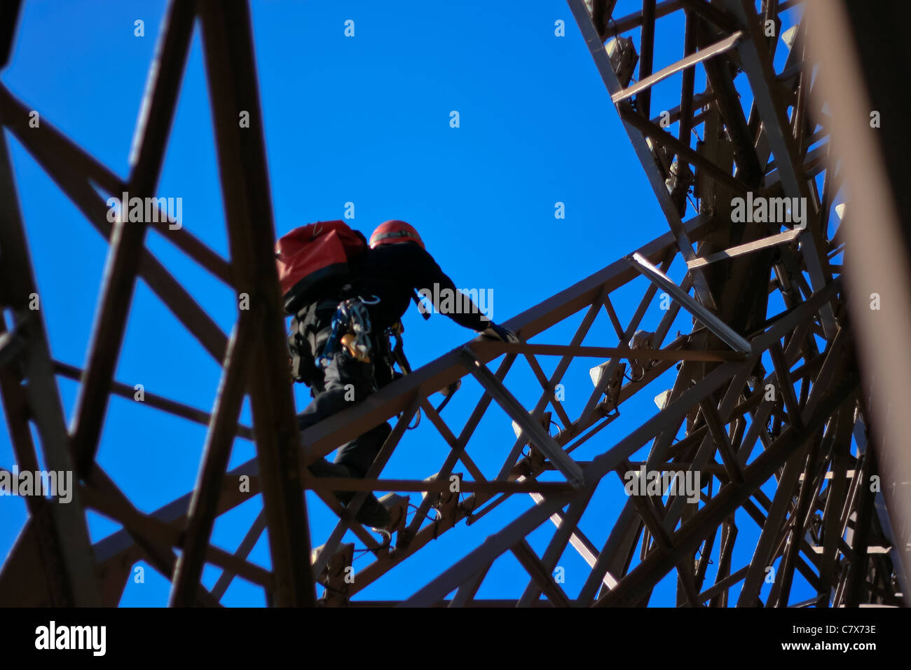 man climbing eiffel tower for maintenance Stock Photo - Alamy