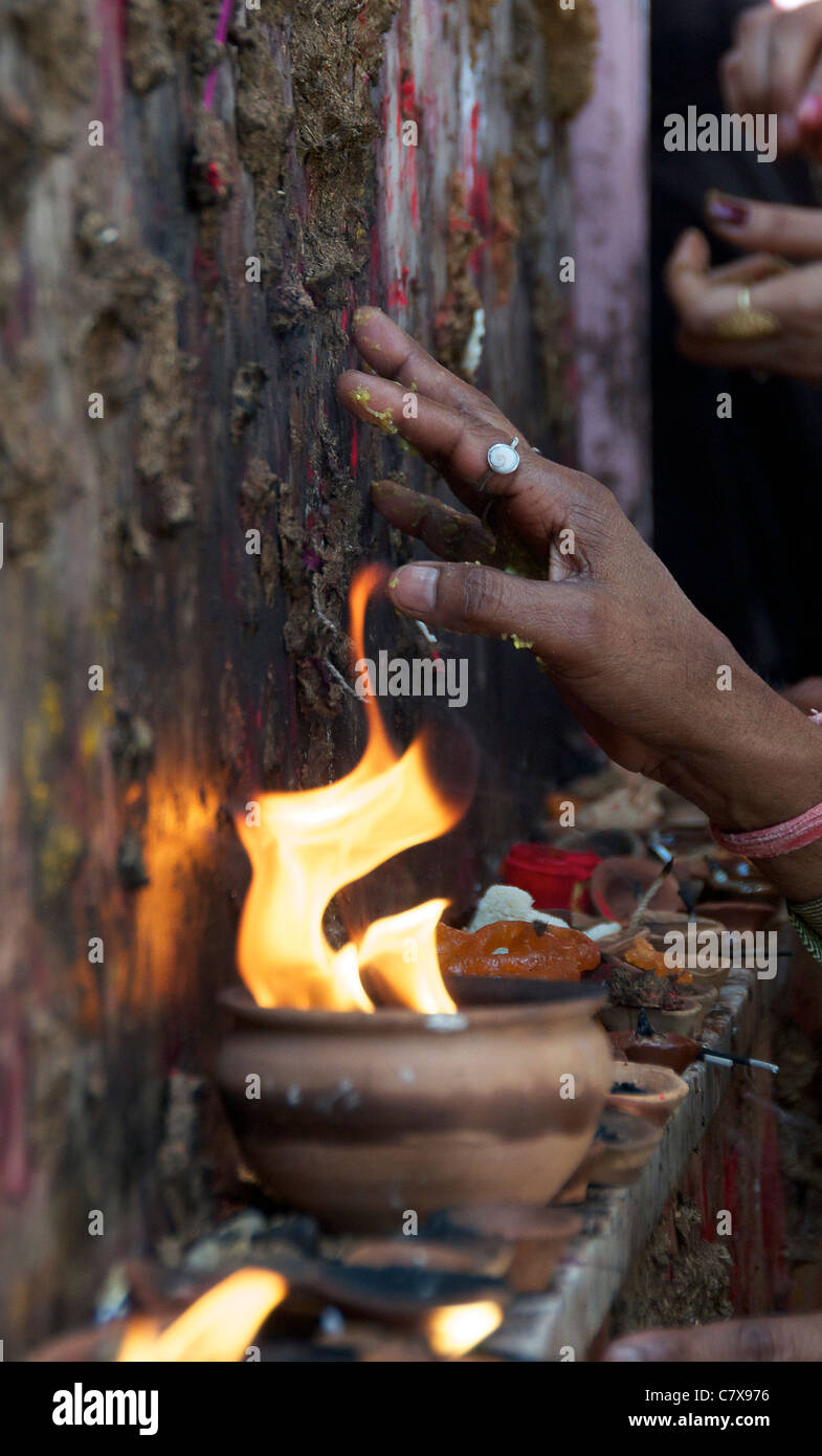 Close-up hands touching sacred wall Kaila Devi Temple Rajasthan India ...