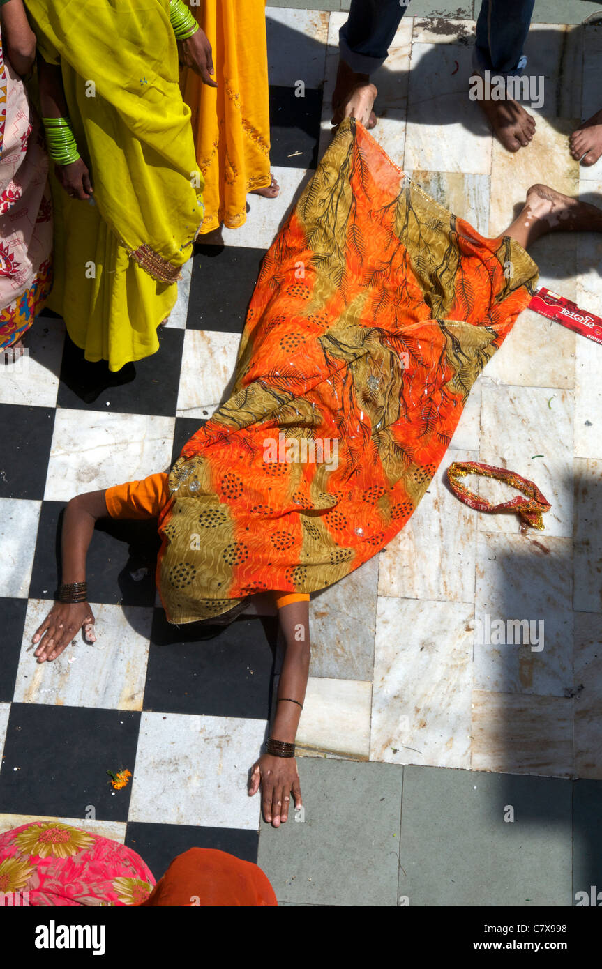 Devout woman prostrating at Kaila Devi Temple Rajasthan India Stock ...