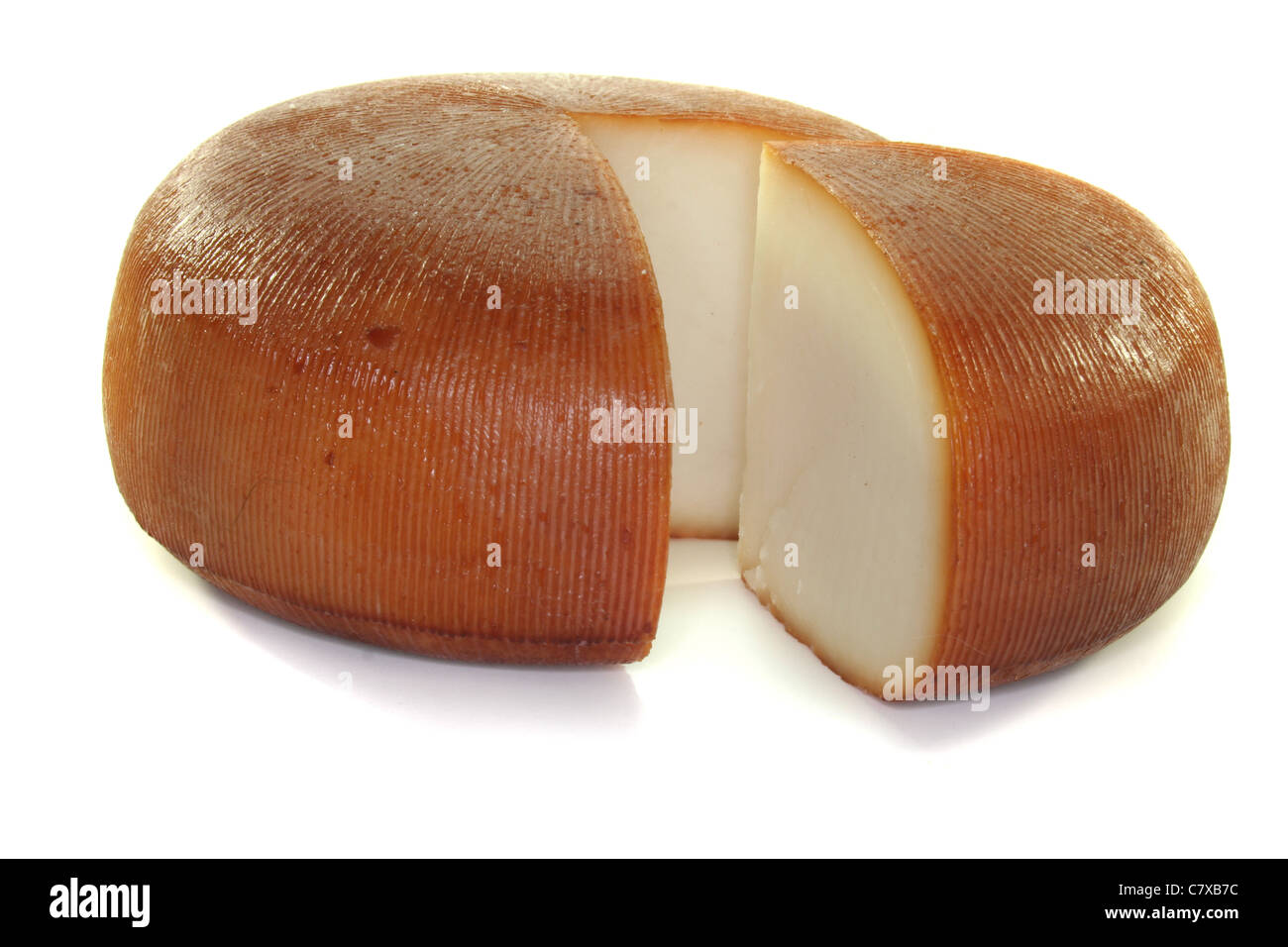 a loaf of smoked goat cheese on a white background Stock Photo - Alamy