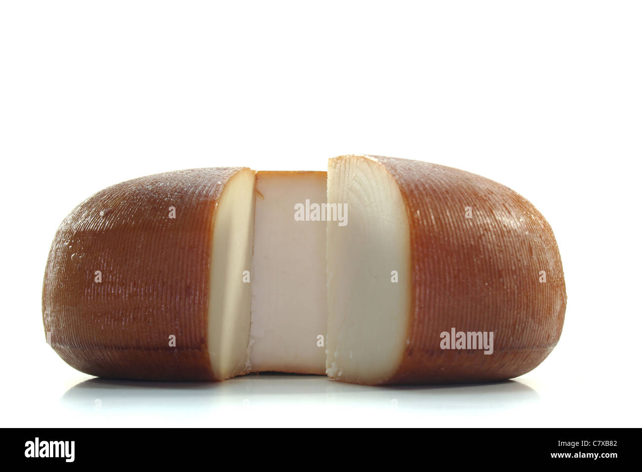 a loaf of smoked goat cheese on a white background Stock Photo - Alamy