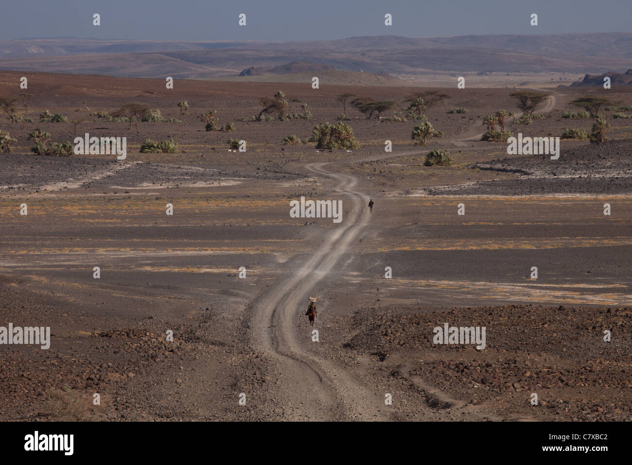 People walking on desert track, Loiyangalani, Turkana, Kenya, Africa ...