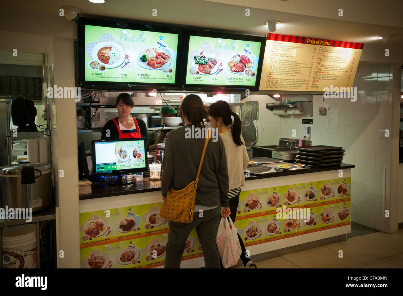 Customers order at the restaurant stand in a food court in Koreatown in ...