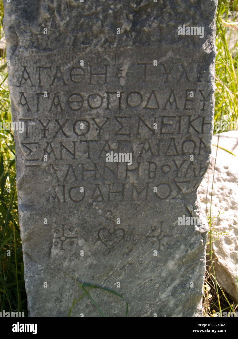 Temple of Apollo - writing on the stone Stock Photo - Alamy