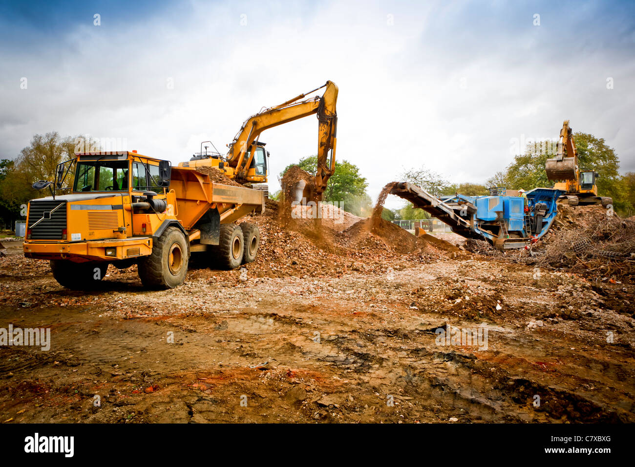 Demolition and ground works on construction site with construction ...