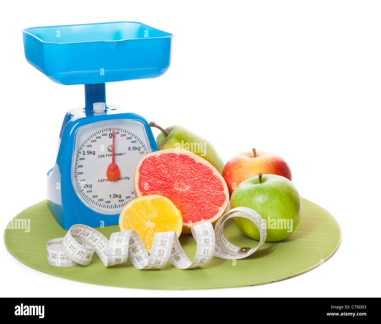 A lot of different fruits and scale isolated on white Stock Photo - Alamy