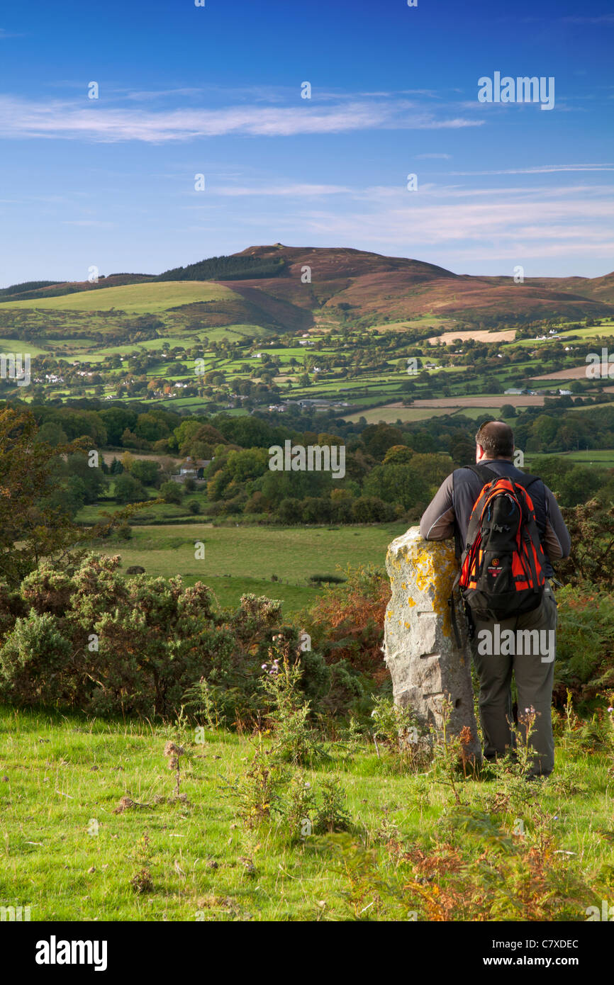 Hill walker looking towards Moel Famau and the Clwydian Range in North ...