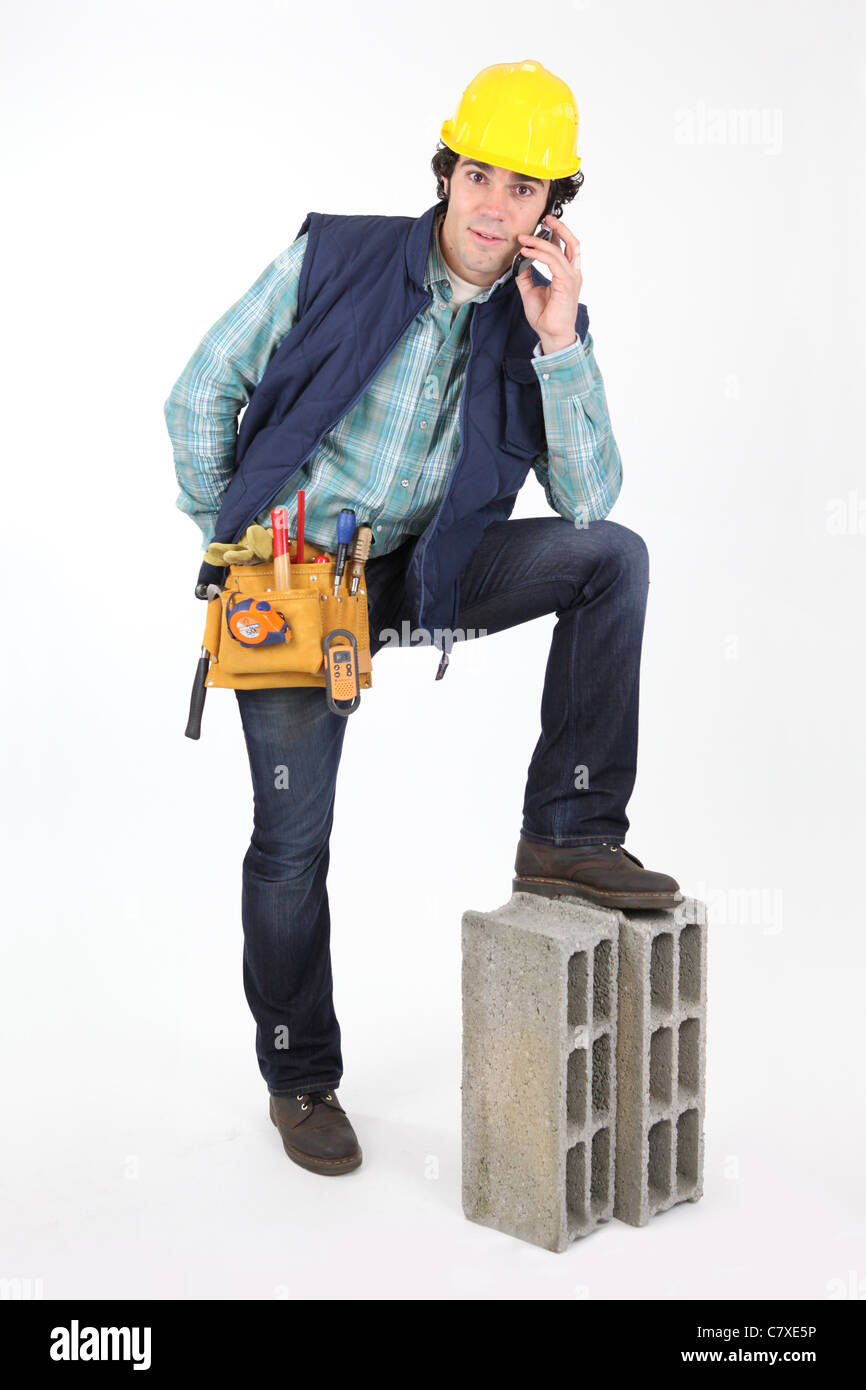 Construction worker using a cellphone Stock Photo - Alamy