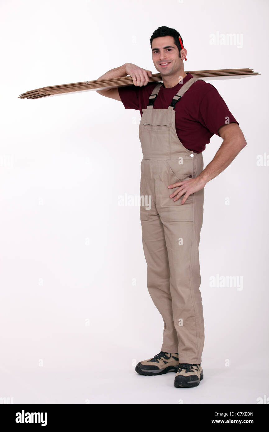Happy woodworker standing on white background Stock Photo - Alamy