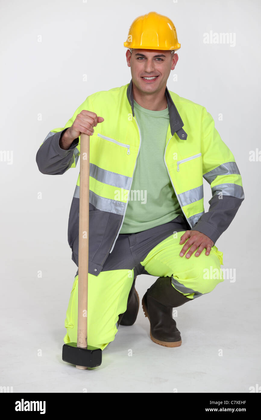 portrait of bricklayer all smiles with safety outfit Stock Photo - Alamy