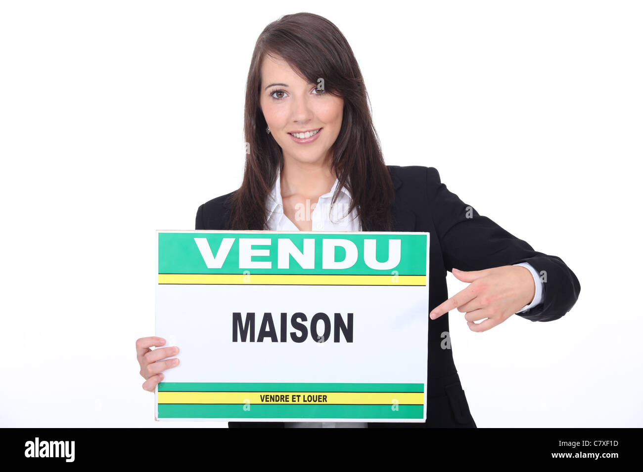 French Estate Agent with a 'Vendu' sign Stock Photo - Alamy