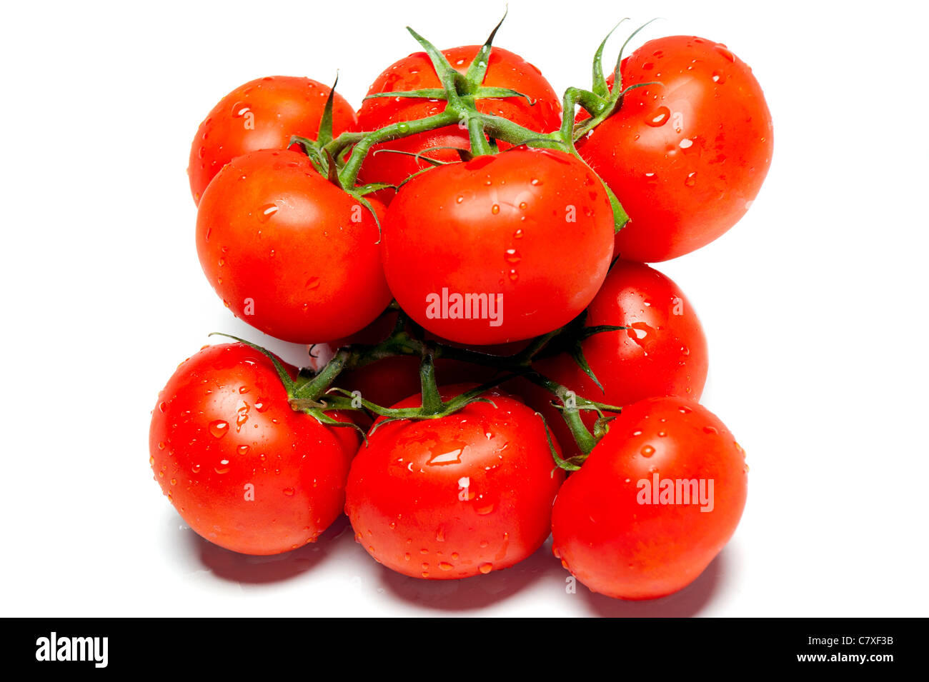 Ripe red tomatoes on isolated white studio background Stock Photo - Alamy