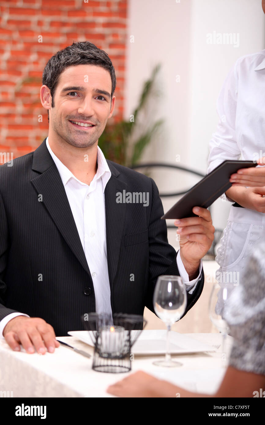 businessman eating in a restaurant Stock Photo - Alamy