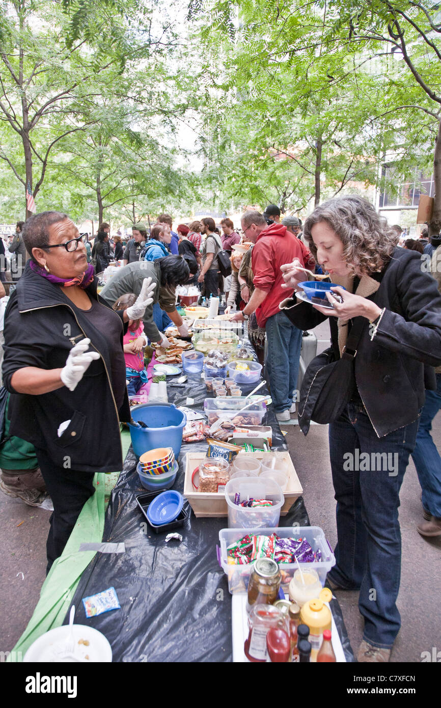 protesters line up for food in their park base camp where black ...