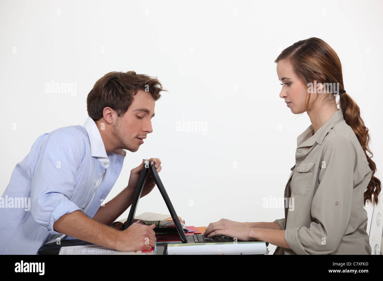 Man helping lady with laptop Stock Photo - Alamy
