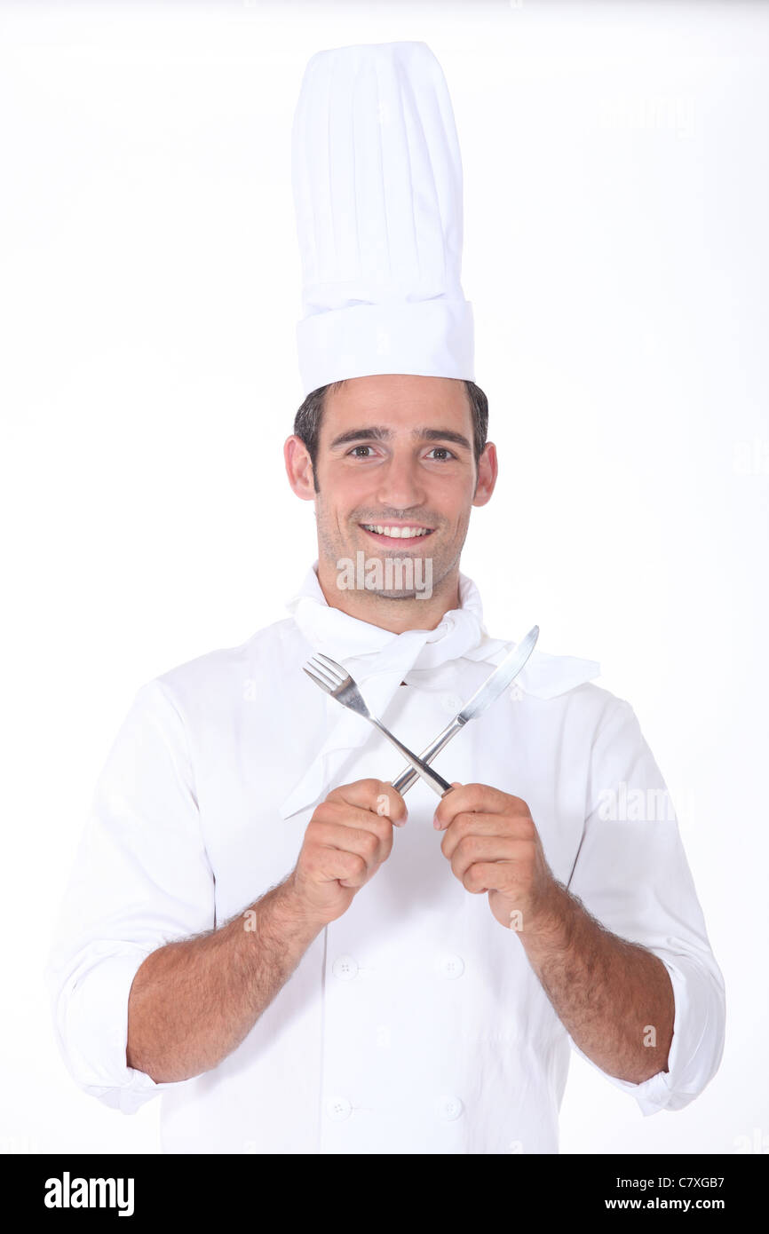 Chef with crossed cutlery Stock Photo - Alamy
