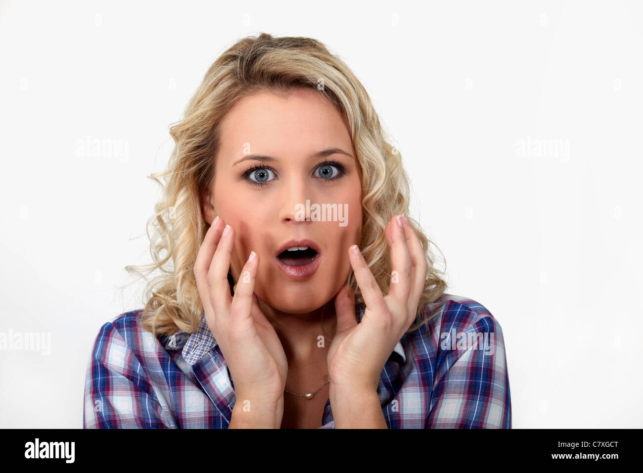 Young woman in shock Stock Photo - Alamy