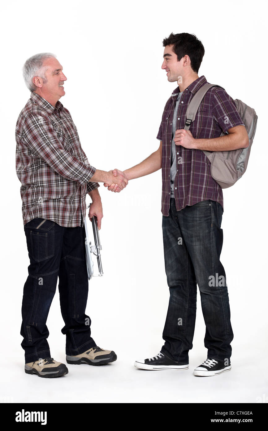 Young apprentice meeting his new boss Stock Photo - Alamy