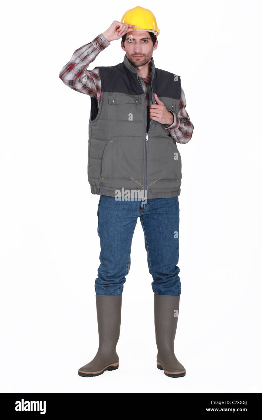 Tradesman giving a salute Stock Photo - Alamy