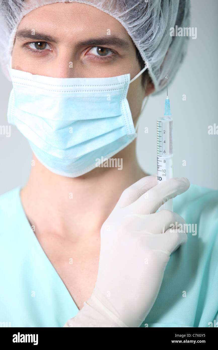 Nurse holding injection Stock Photo - Alamy