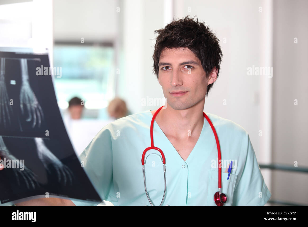 Male nurse examining x-ray image Stock Photo - Alamy