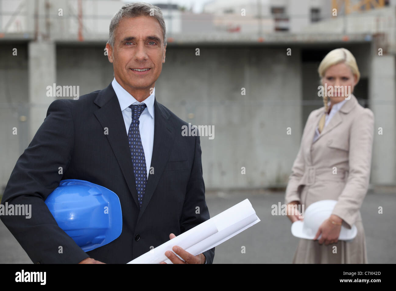 couple of executive in a construction site Stock Photo - Alamy