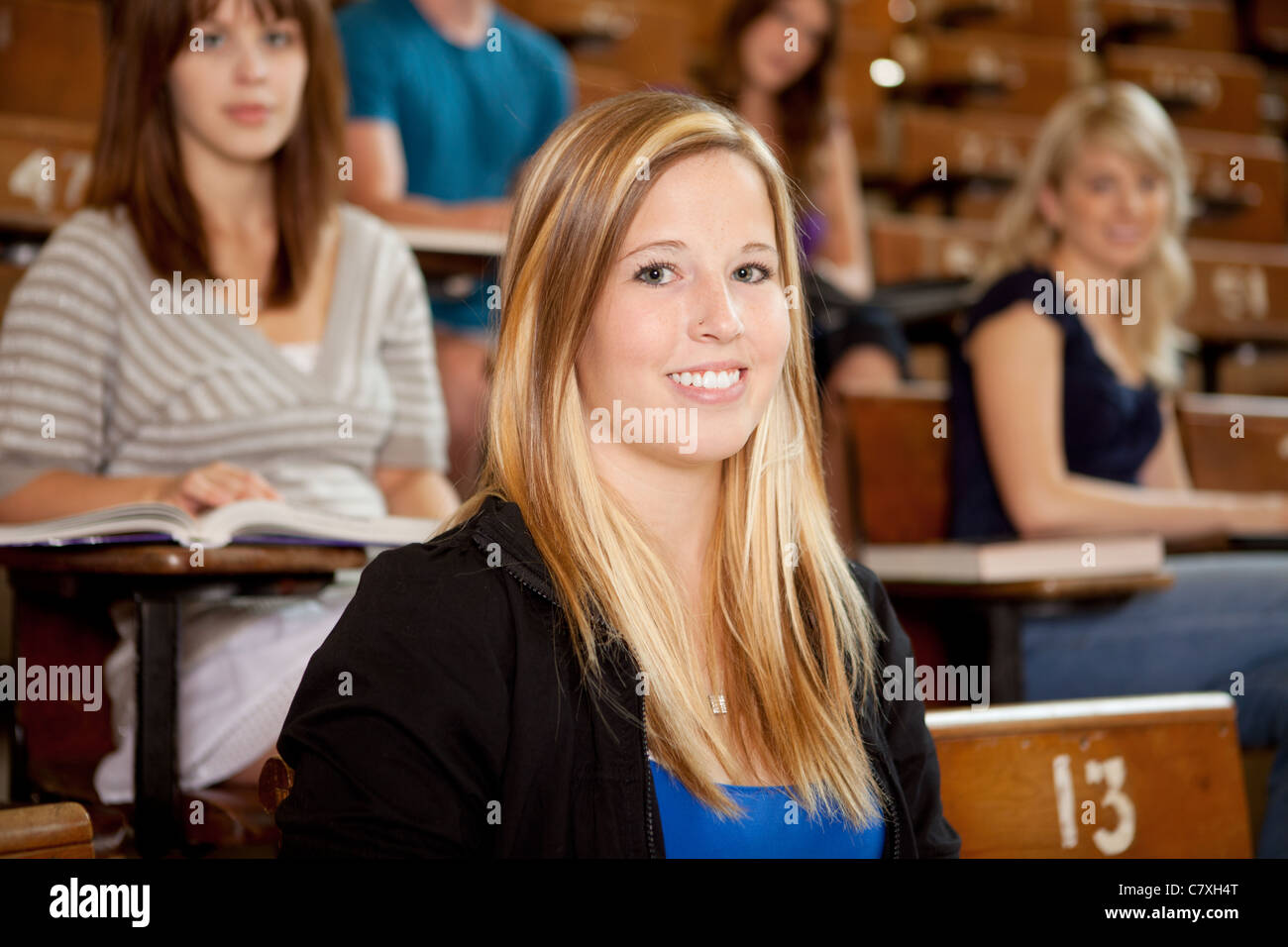 Happy young student at university class Stock Photo - Alamy
