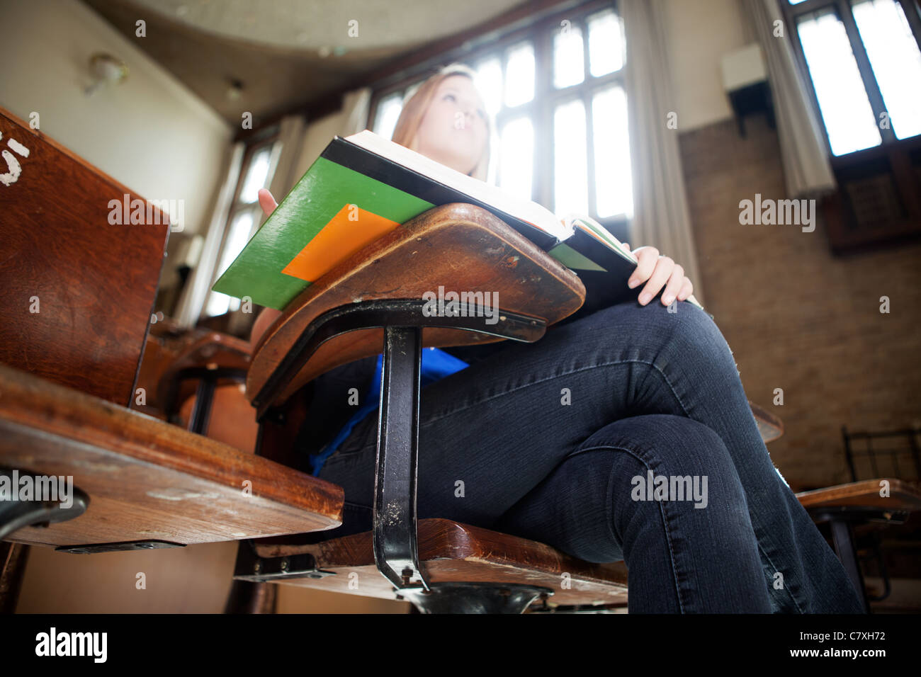 Young student listening to lecture at University Stock Photo - Alamy