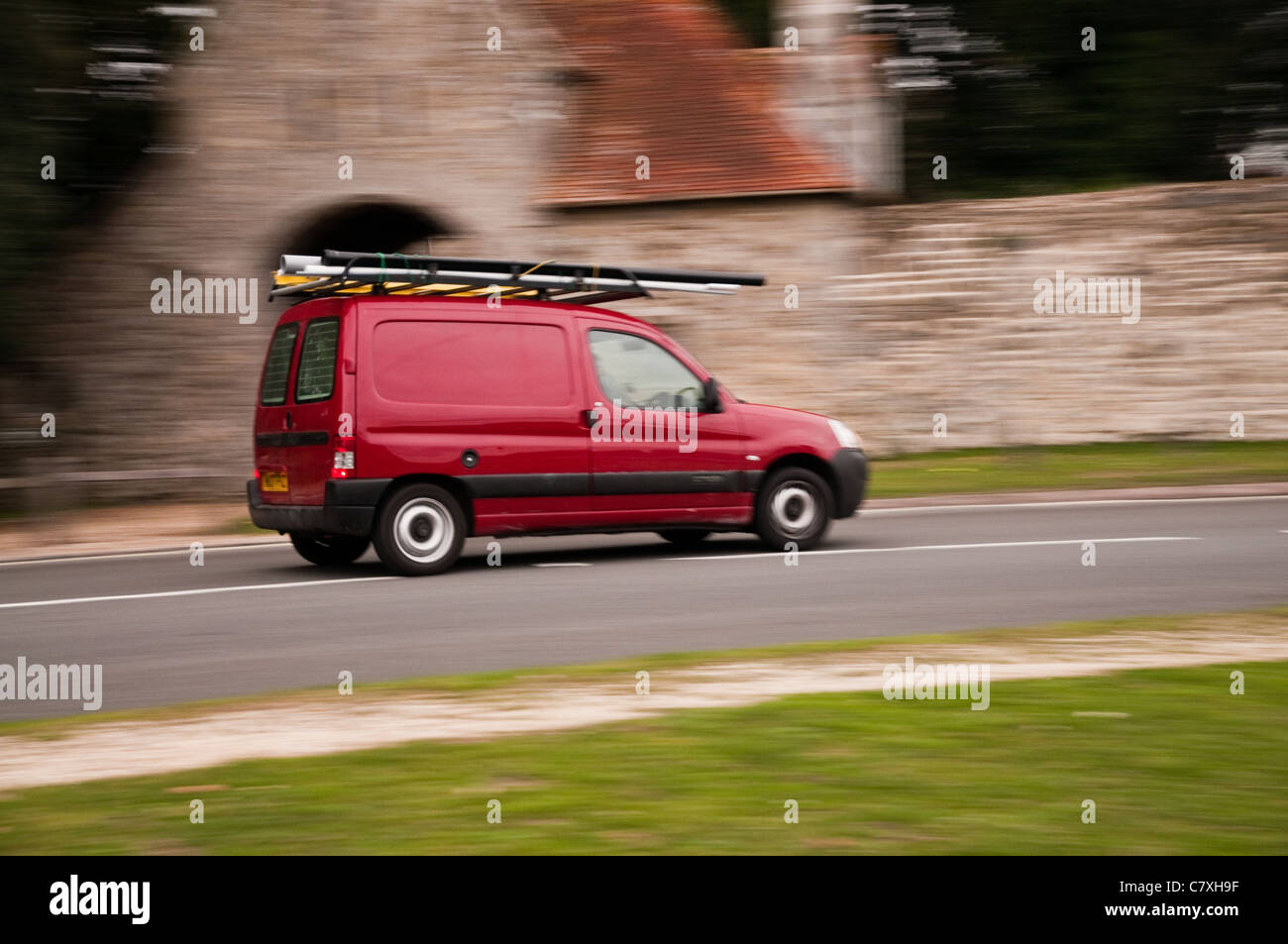 Fast moving cyclist/van in motion Stock Photo - Alamy