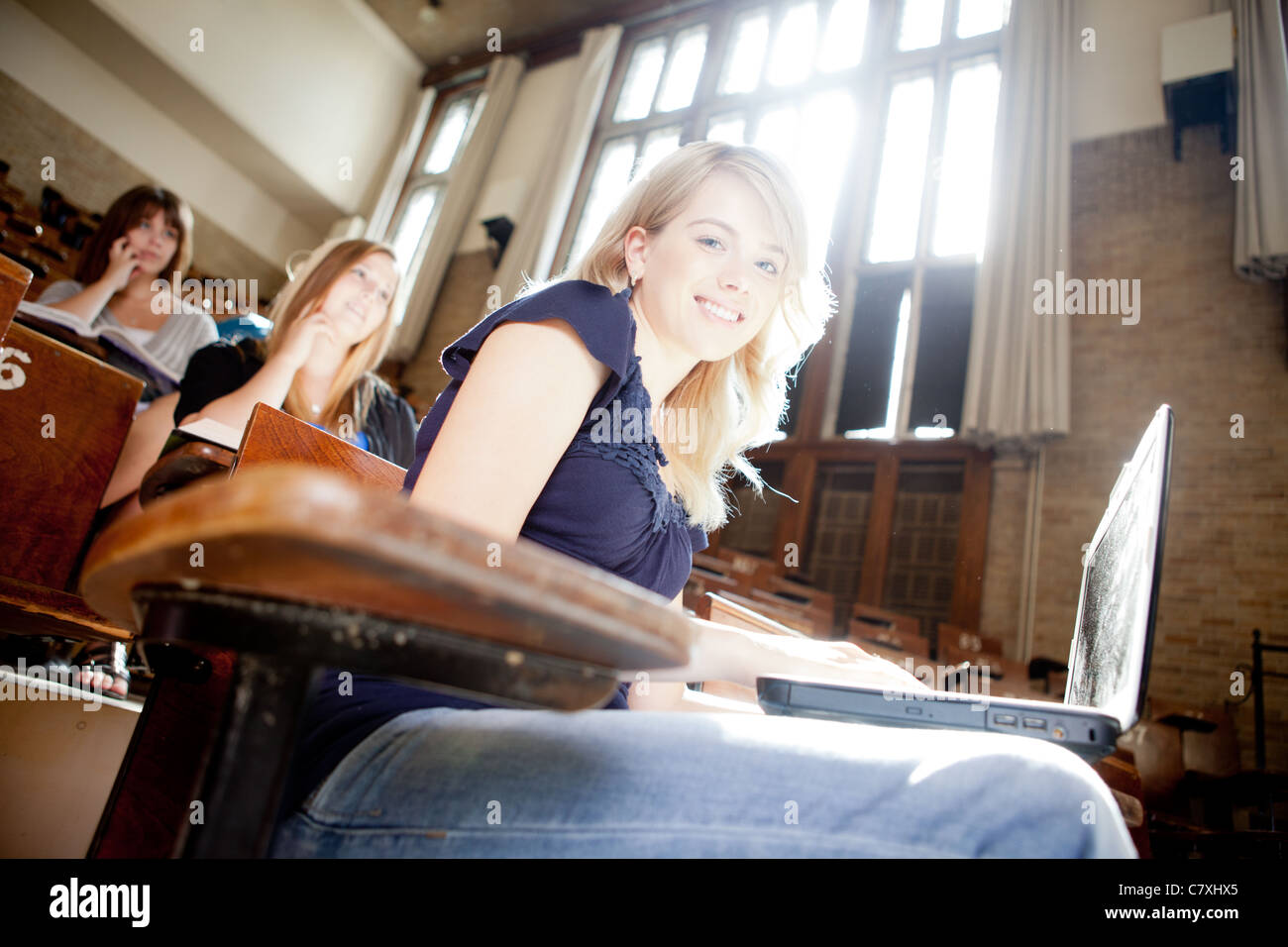 Students in a lecture hall with strong backlighting Stock Photo - Alamy