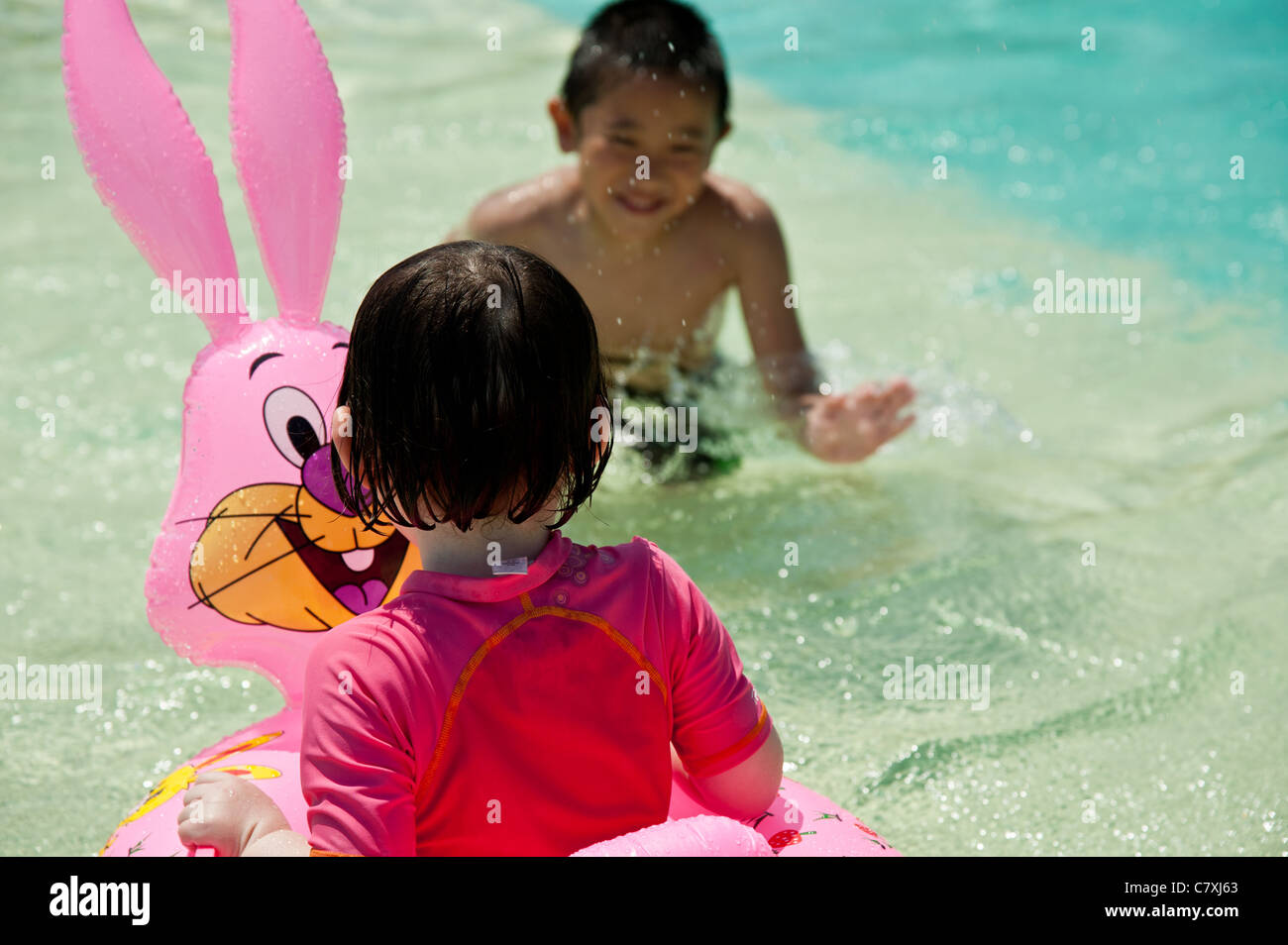 Children playing in water china hi-res stock photography and images - Alamy