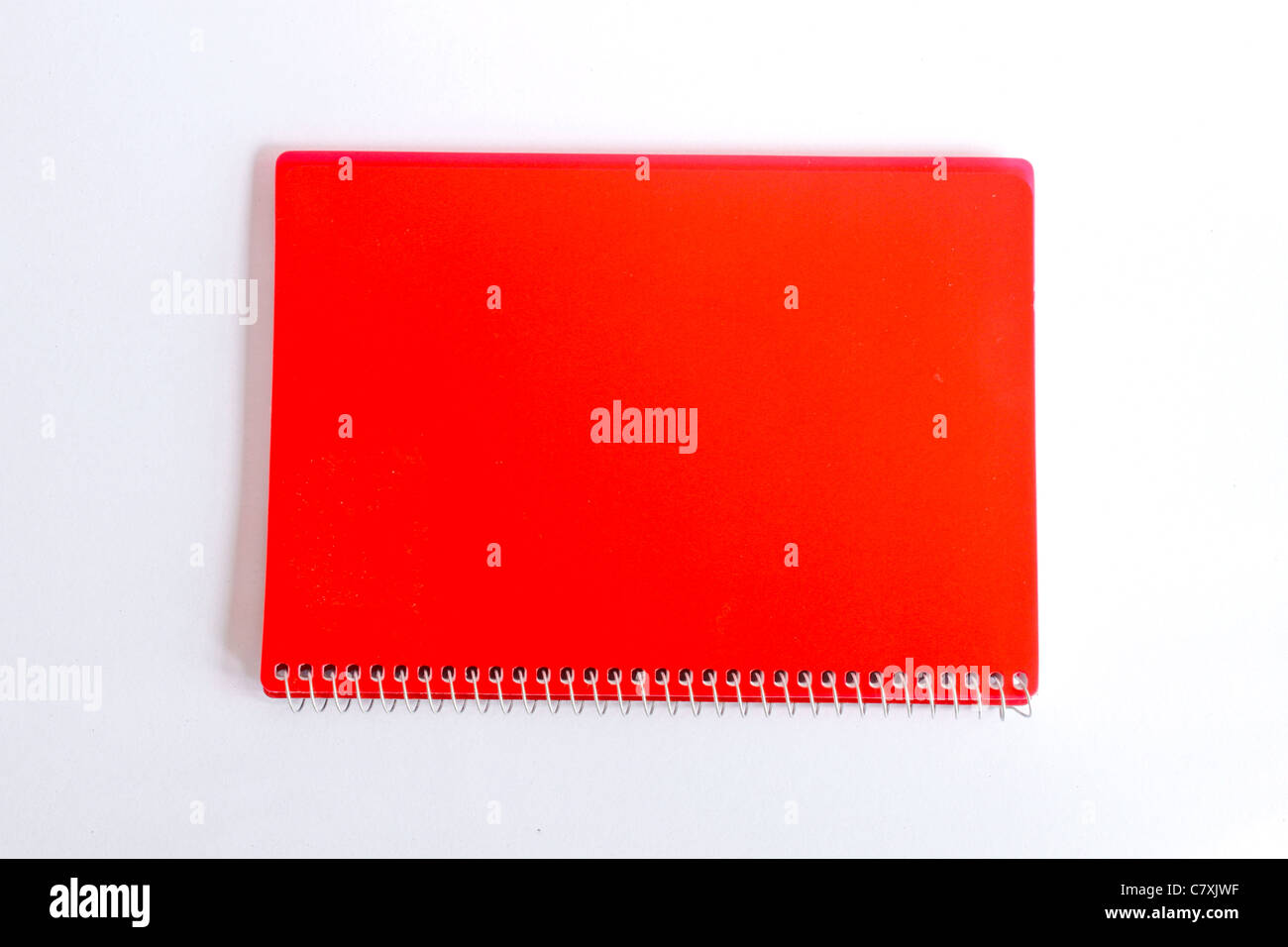 isolated red notebook on white color background Stock Photo - Alamy