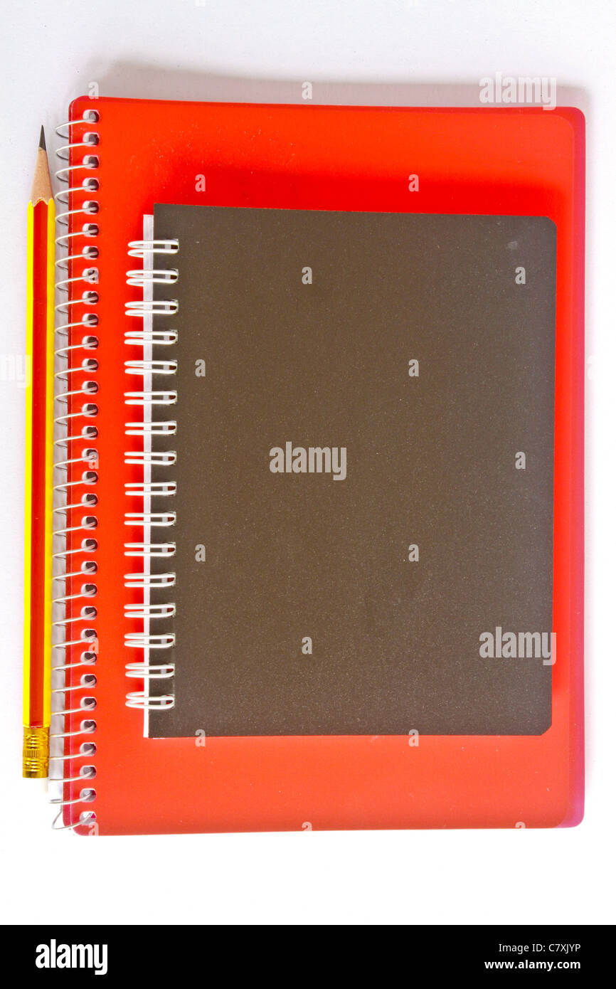 Black and red notebook with pencil on white color background Stock ...