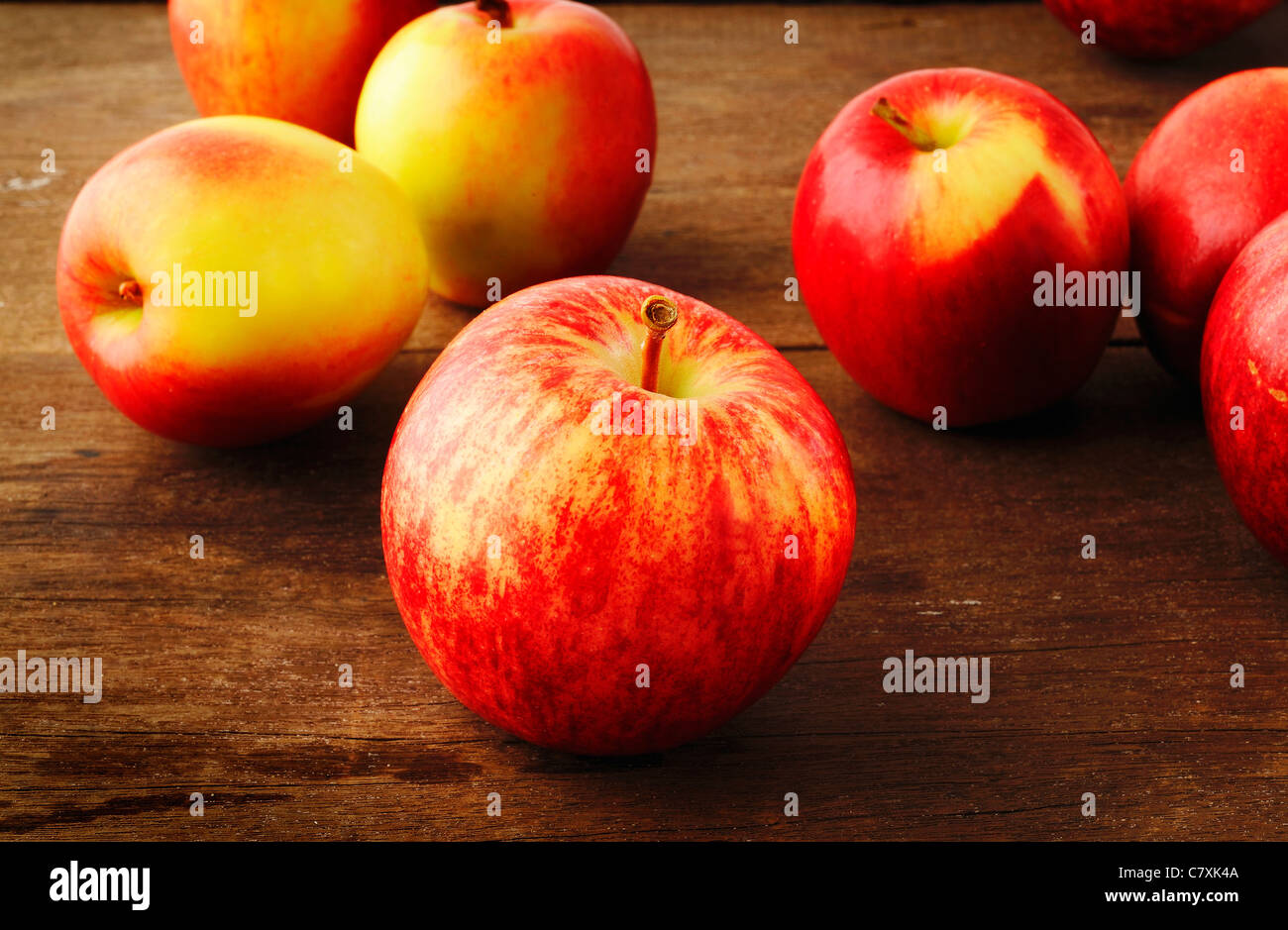 red apple on wood background Stock Photo - Alamy