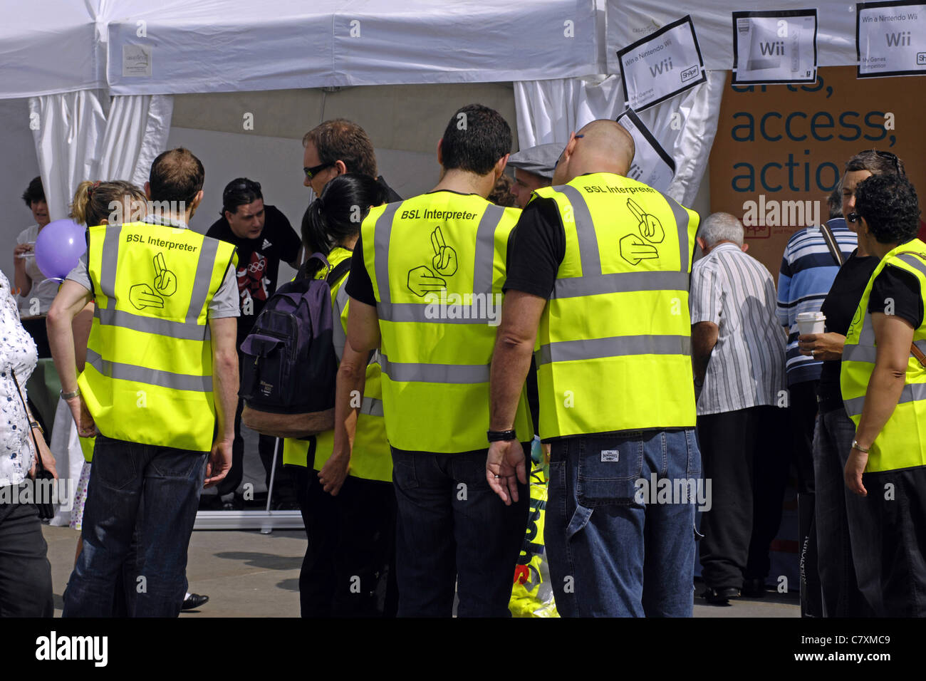 Deaf Sign language Interpreters wearing yellow jackets at the Liberty ...
