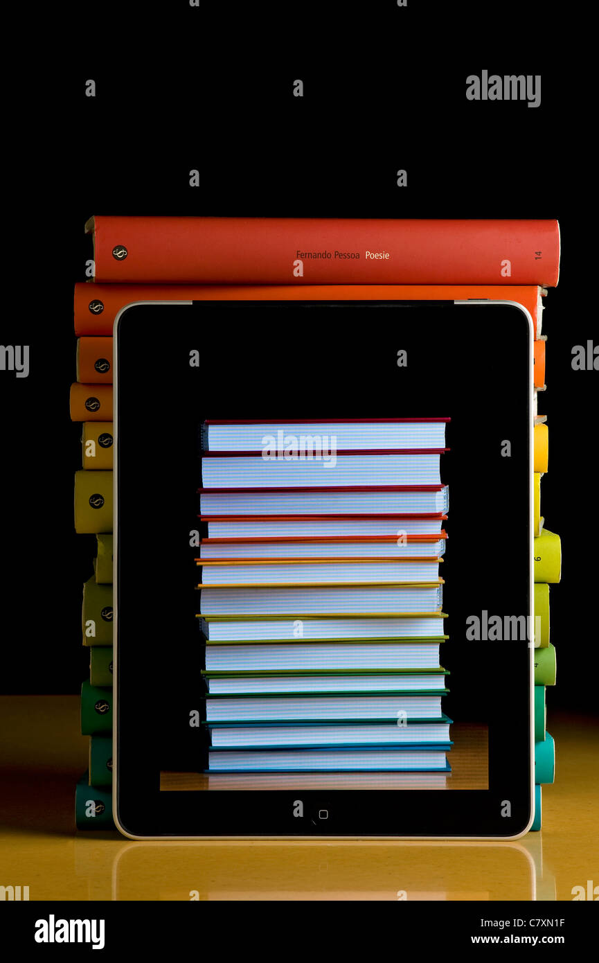 Ipad and paper books Stock Photo - Alamy