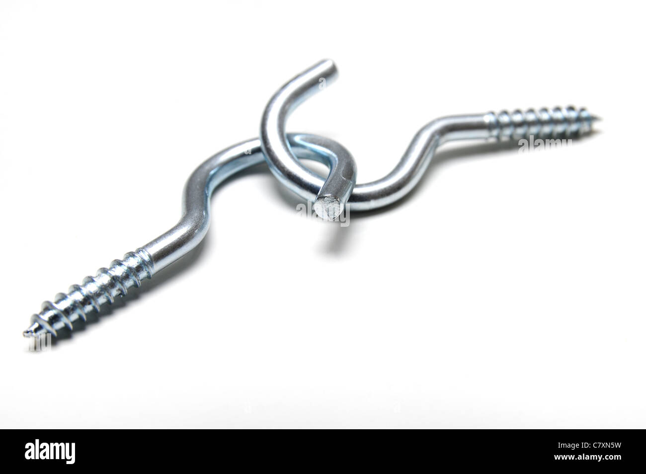 Two connected threaded hooks on white background Stock Photo - Alamy