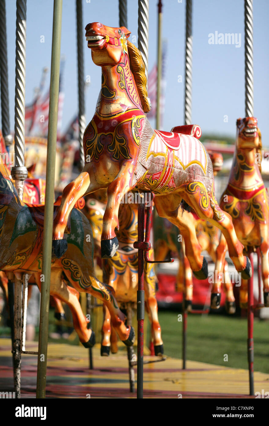 Vintage childrens horse merry go round ride Stock Photo - Alamy